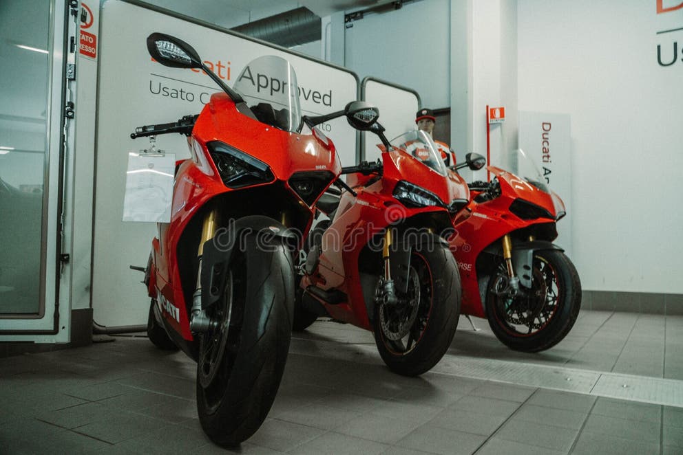 Red motorcycles in a store editorial photo. Image of style - 268083911