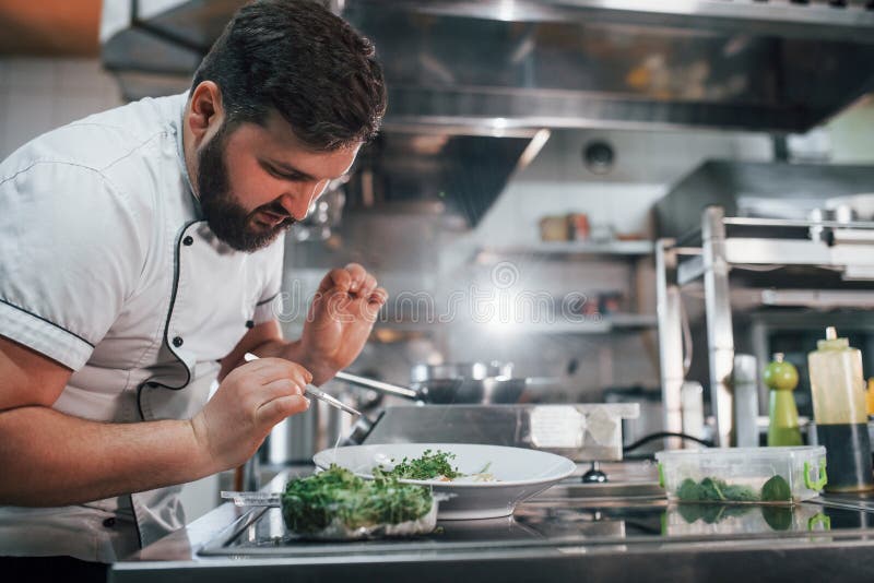 Some Additional Ingredients. Professional Chef Preparing Food in the ...
