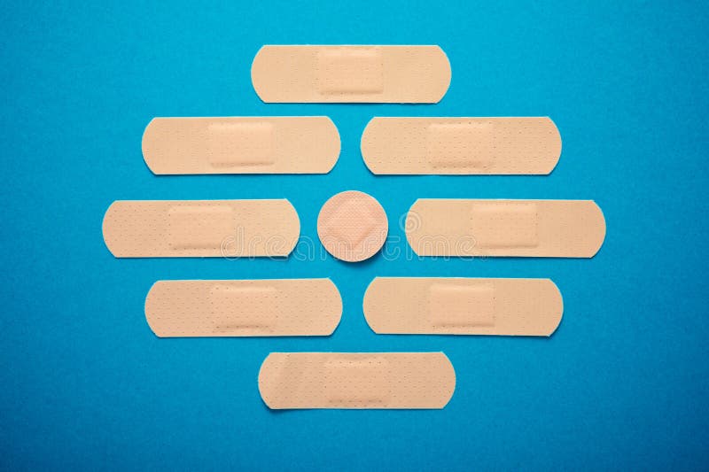 Some Band-aids on a Blue-green Table Stock Image - Image of dirt, band ...