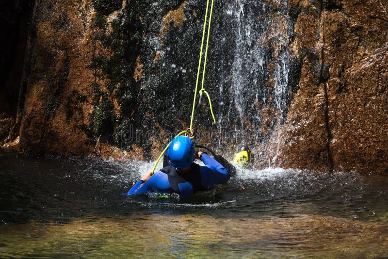 Canyoning Climbing on an Waterfall Stock Photo - Image of helmet, climb ...