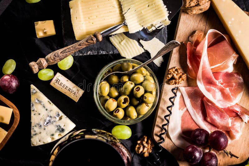Some cheese and wine set. stock photo. Image of dark - 113868070