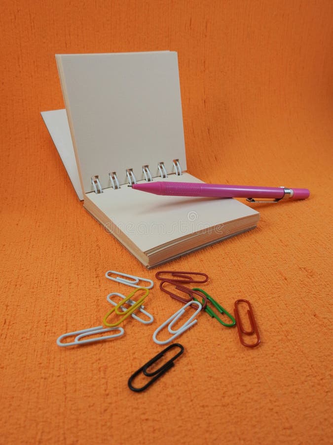 Some Colored Paper Clips, a Small Blank Notepad and a Mechanical Pencil ...