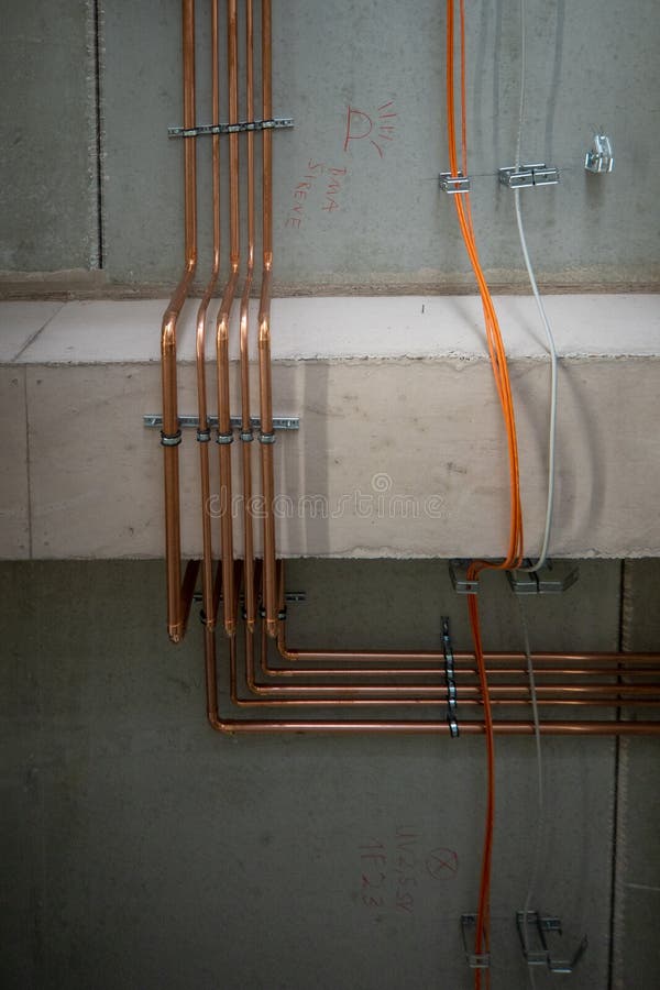 Some Copper Pipes Run Side by Side on a Wall Stock Image - Image of ...