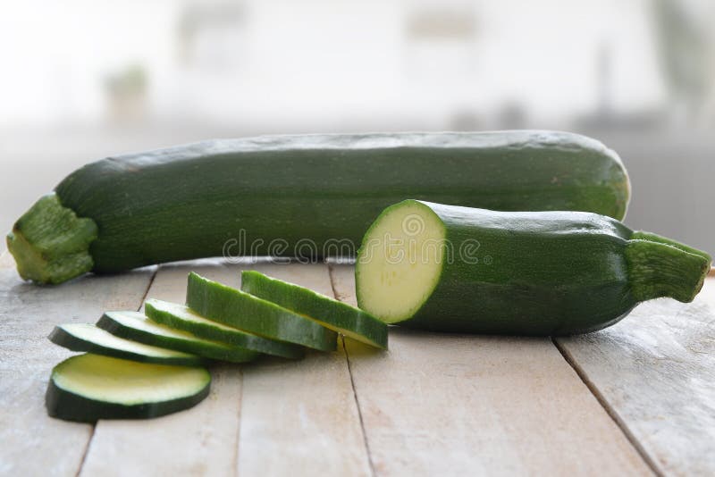Some Courgette Sliced on a White Wooden Table in a Rusic Kitchen. Stock ...