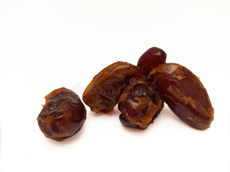 Some Dates Stacked on Isolated White Background, Five Dry Sweet Dates ...