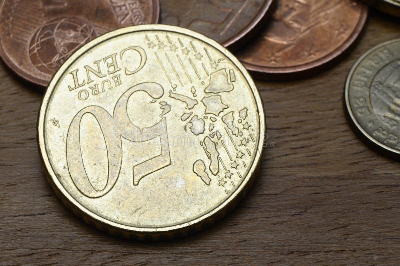 Some Euro Coins, One of Fifty Cent Stock Photo - Image of bill, wood ...