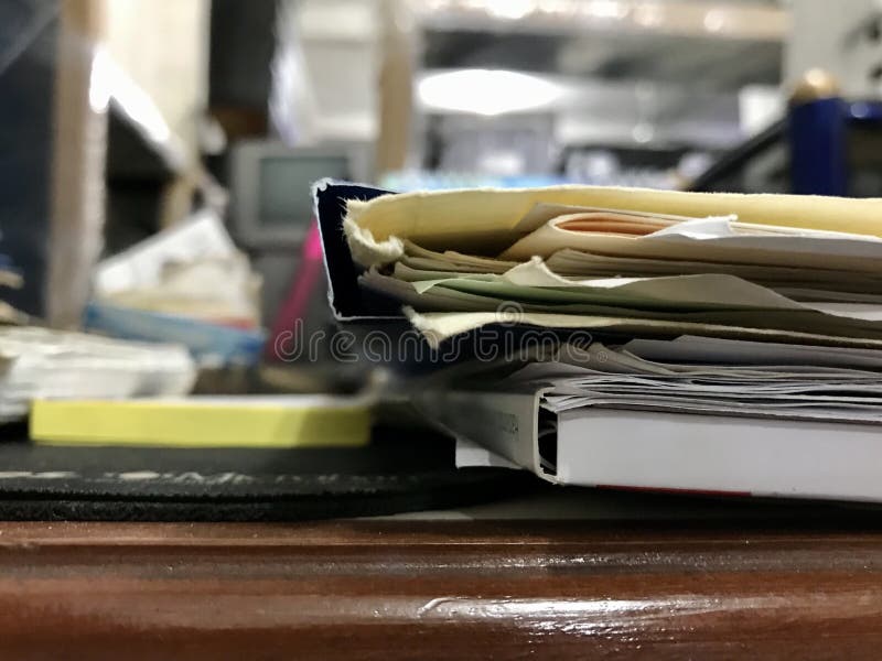 Some File Folders Stacked on Top of a Desk Stock Photo - Image of bill ...