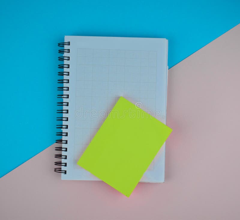 Some Light Green Sticky Notes on Top of a White Paper Diary before a ...