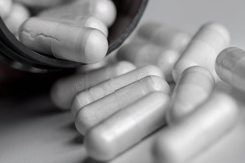 Medical Capsules Out of the Pack Stock Photo - Image of energy, black ...
