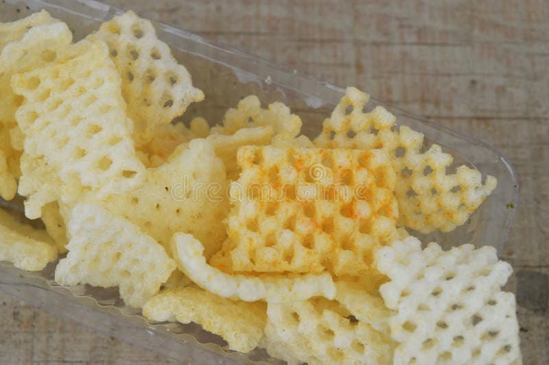 Some Mesh Chips in a Plastic Container Stock Image - Image of flavor ...