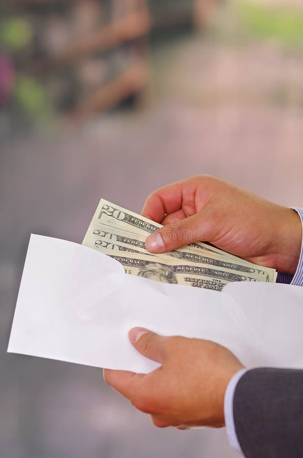 Politician in Dark Suit and with Tie Putting Money in His Suit Stock ...