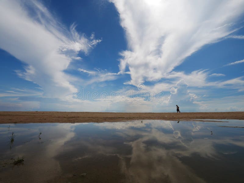 Some one on the beach stock photo. Image of puddle, evening - 102845656