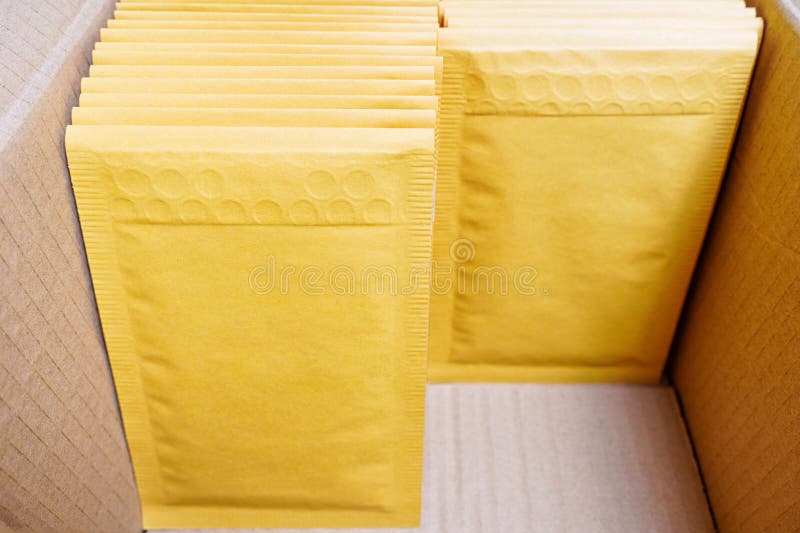 Some Padded Envelopes in a Shipping Box Stock Photo - Image of product ...