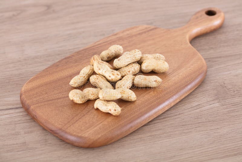 Some Peanuts on Cutting Board Stock Photo - Image of life, peanuts ...