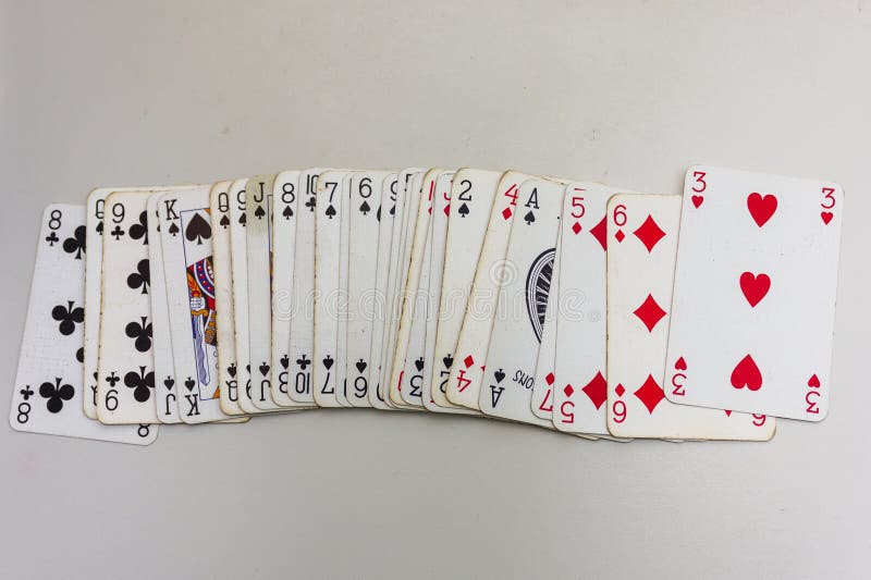 Playing cards on a table stock image. Image of still - 328171693