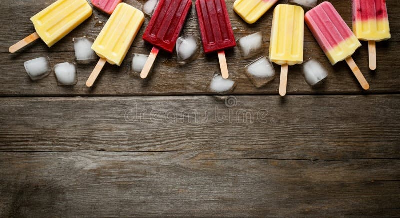 Some Popsicles on Fresh Ice Cubes, Popsicle Background on Table Stock ...