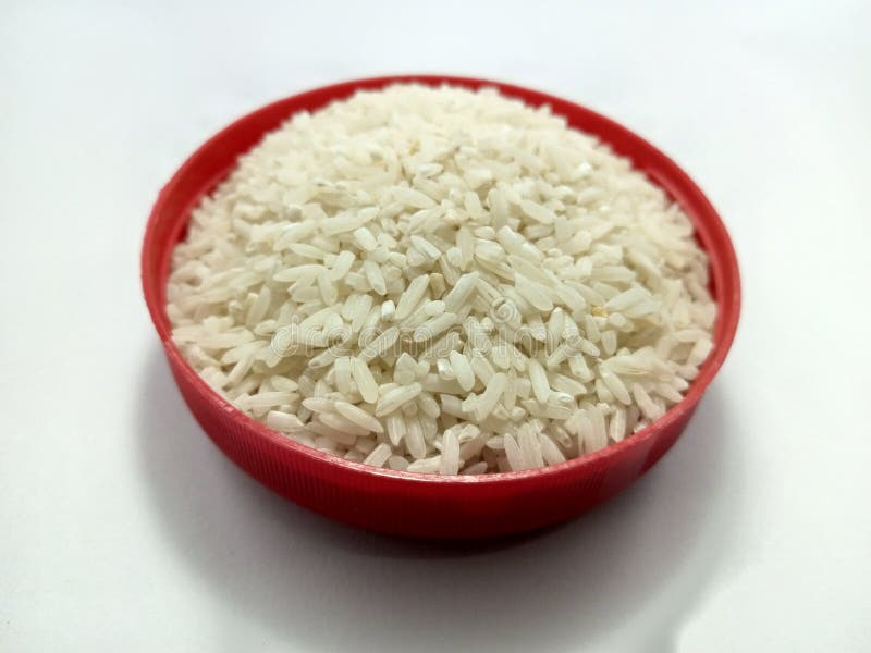 Some Ready-to-cook Rice is Placed on a Red Container on a White ...