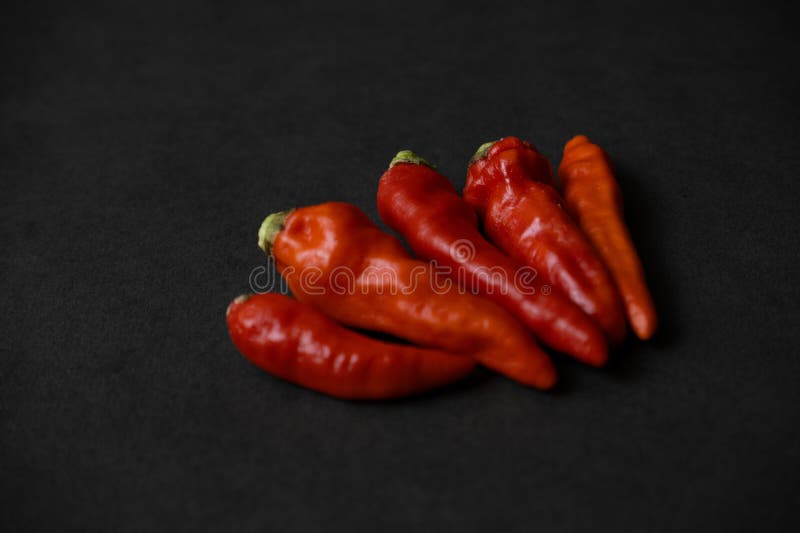 Some Red Chillies on the Dark Table Stock Image - Image of chilly ...