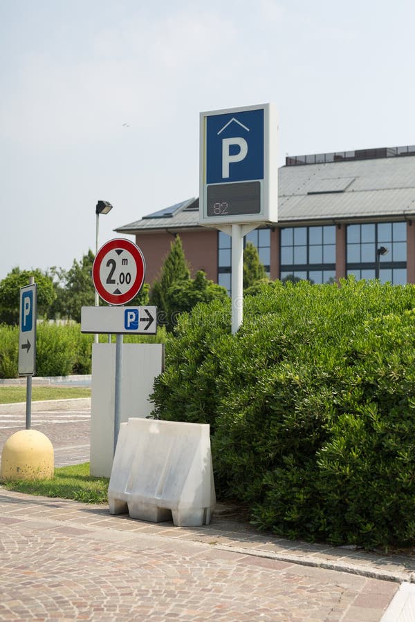 Some Road Signs Indicating a Parking Area Stock Photo - Image of metal ...