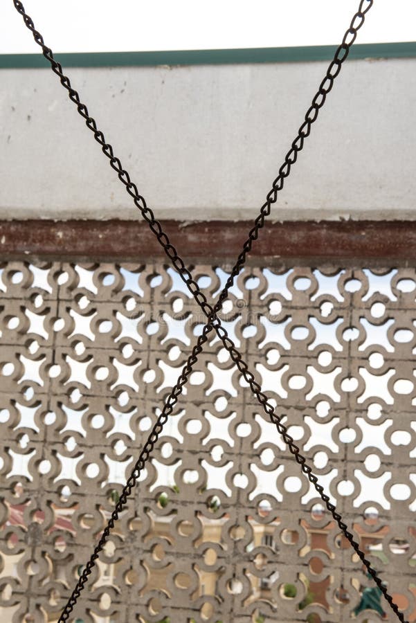 Some Rusty Chains Forming a Cross with a Cement Lattice Stock Photo ...