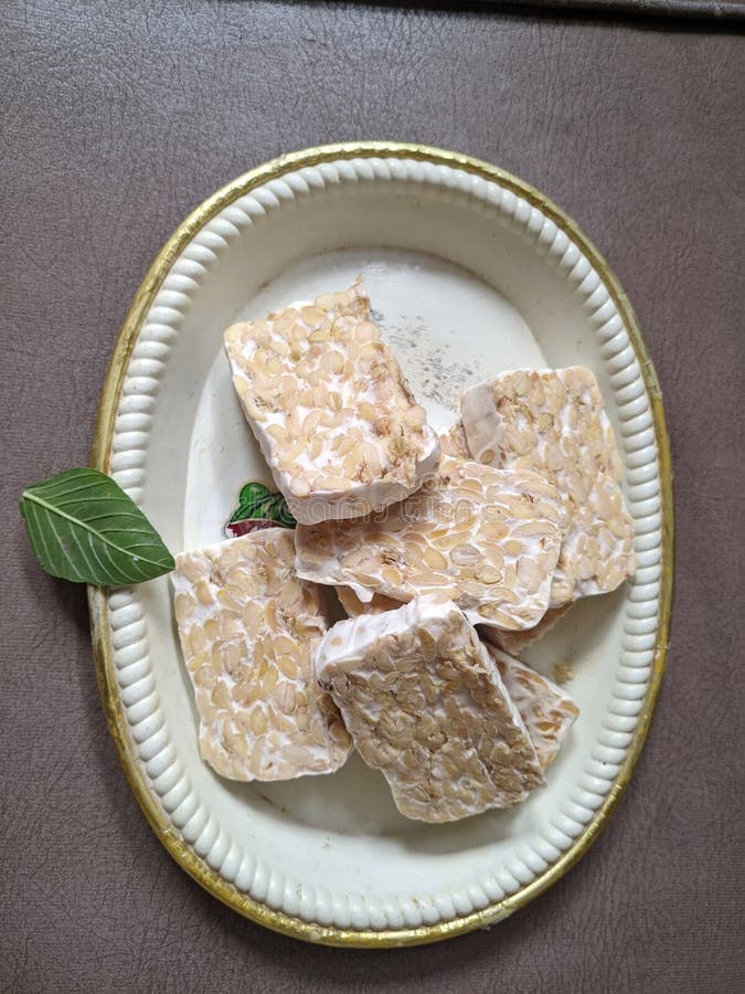 Some Slice of Raw Tempe on a Plate Stock Photo - Image of dessert ...