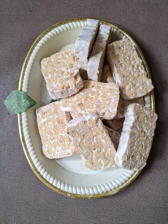 Some Slice of Raw Tempe on a Plate Stock Image - Image of tempe, bread ...