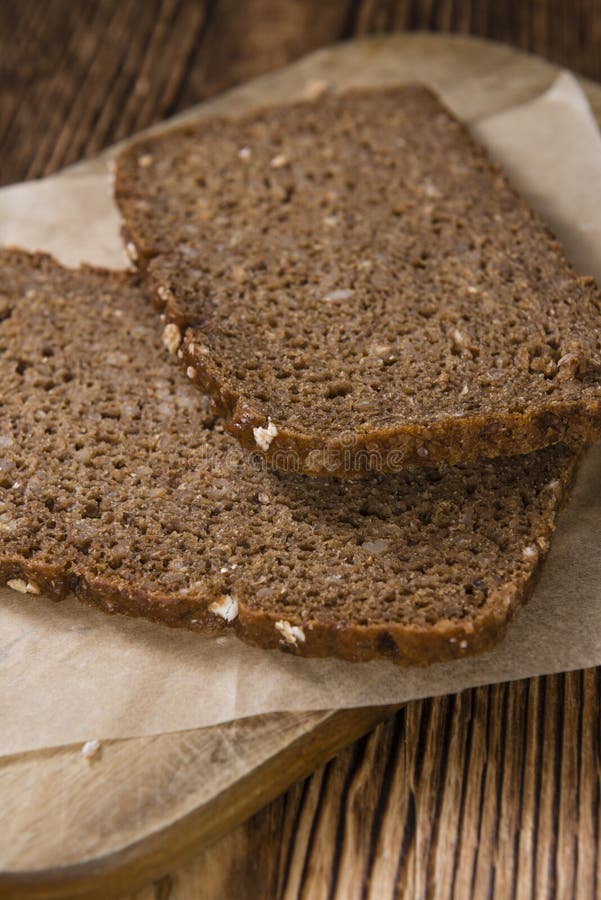 Slices of Brown Bread stock image. Image of bread, cereals - 66972237