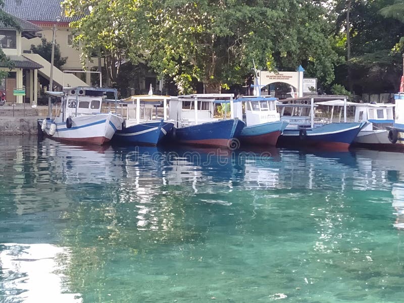 Some Small Boats are Docked in the Harbor Stock Image - Image of ...