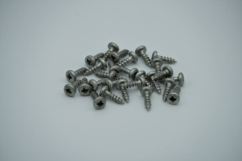 Some Small Screws on White Background Stock Image - Image of iron ...