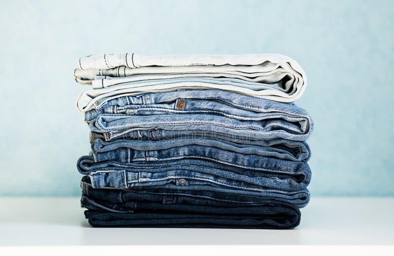 Some Stacked Blue Jeans, Close Up. Denim Collection Stock Photo - Image ...