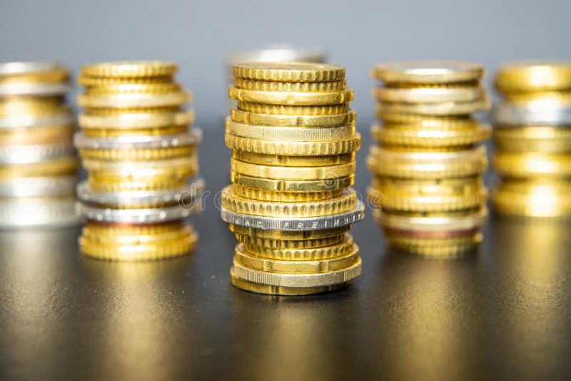 Euro coins on dark table stock photo. Image of expense - 180141600