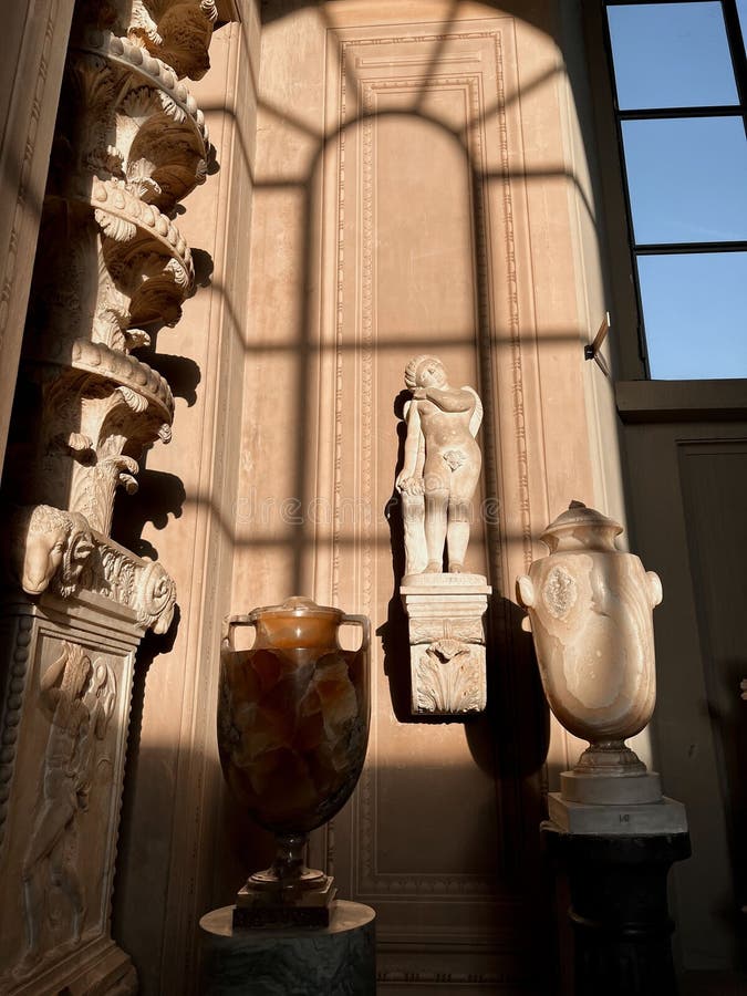 Some Statues and a Very Big Window in a Building a Statue Stock Image ...