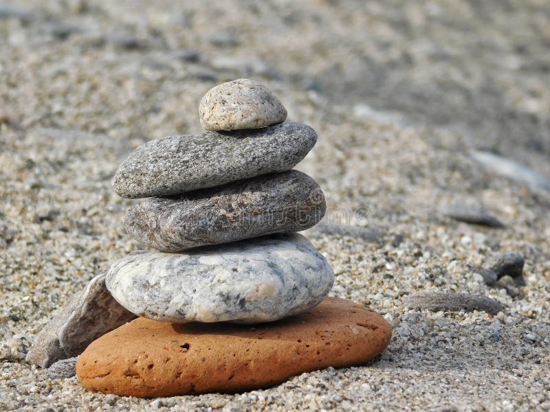 Some stones on a beach stock photo. Image of pyramid - 64406432