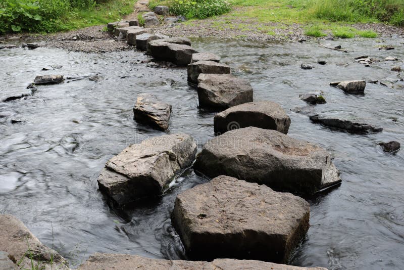 Stones Building a Bridge Over a River Stock Photo - Image of gray ...