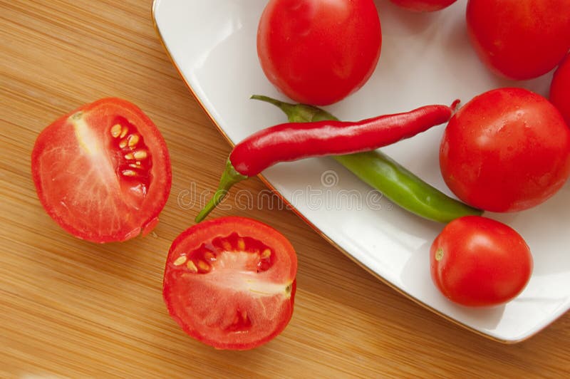 Some tomatoes and peppers stock image. Image of green - 10749379