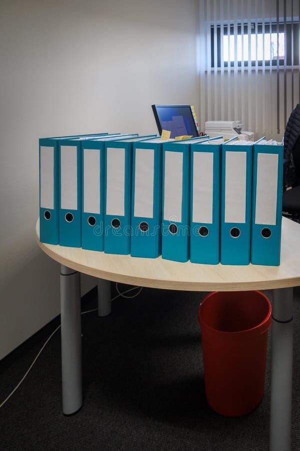 Some Turquoise Folders Stand on a Desk in Office Stock Photo - Image of ...