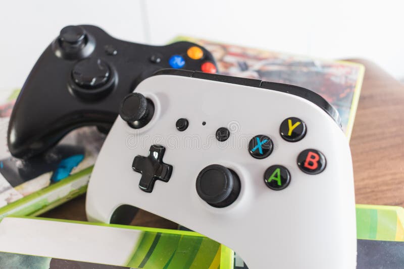 Some Video Game Controllers on Game Boxes Stock Image - Image of ...