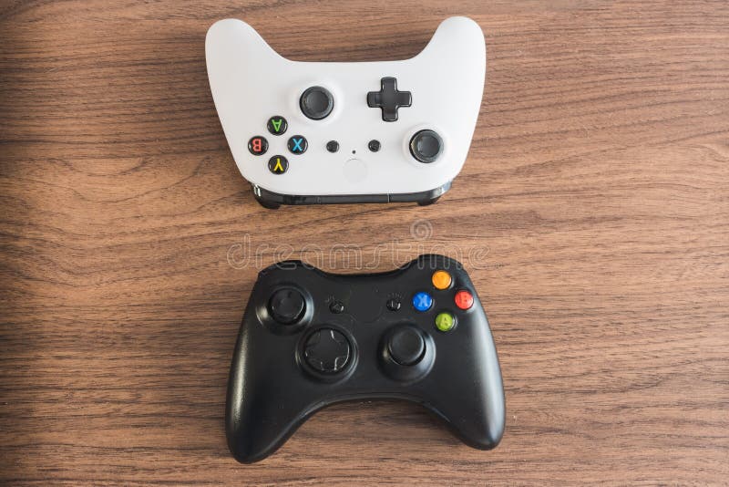 Some Video Game Controllers Wooden Table Stock Photos - Free & Royalty ...