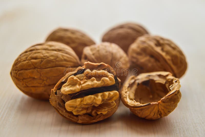 Walnuts in Shell on White Cutting Board Stock Image - Image of shell ...