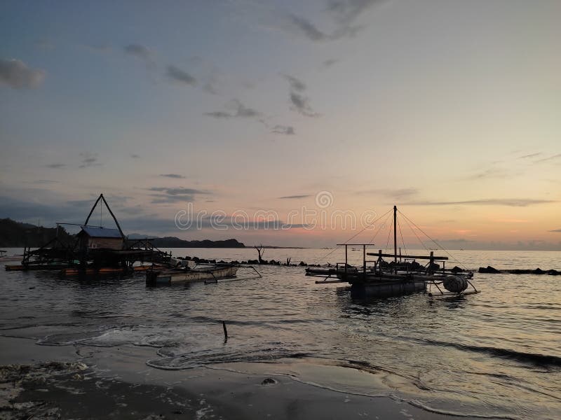 Some Wooden Boats on the Beach after Sunset Stock Photo - Image of ...
