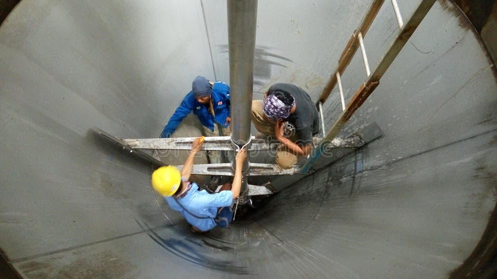 Some Workers are Working in Tanks on Construction Projects Editorial ...