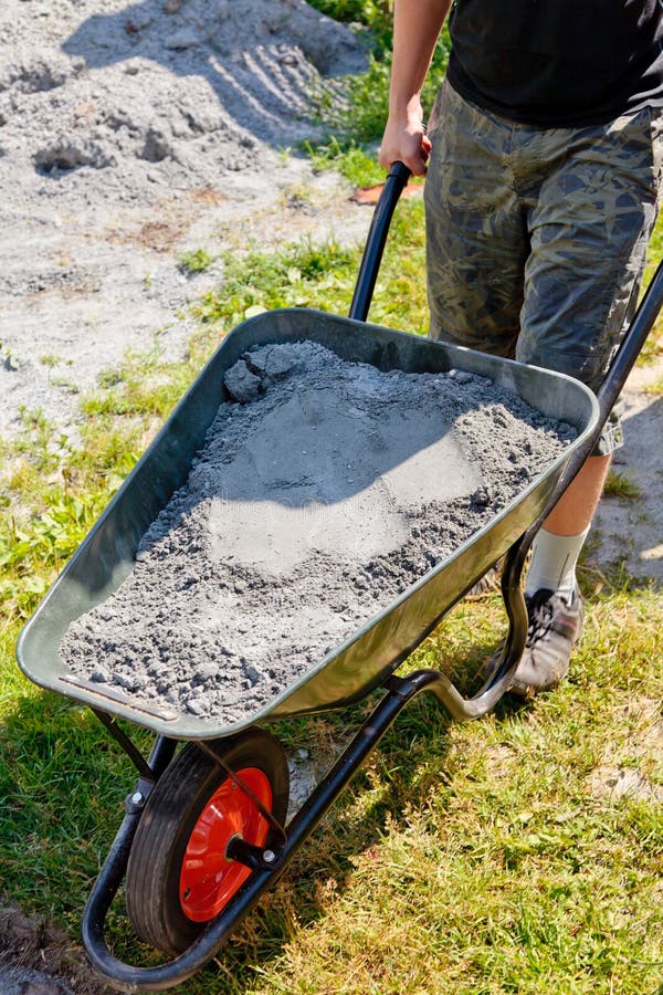 Worker with wheelbarrow stock photo. Image of construction - 5464404