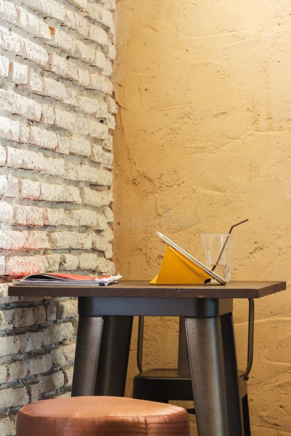 Tablet and Magazine on Wood Table in Cafe. Stock Photo - Image of ...