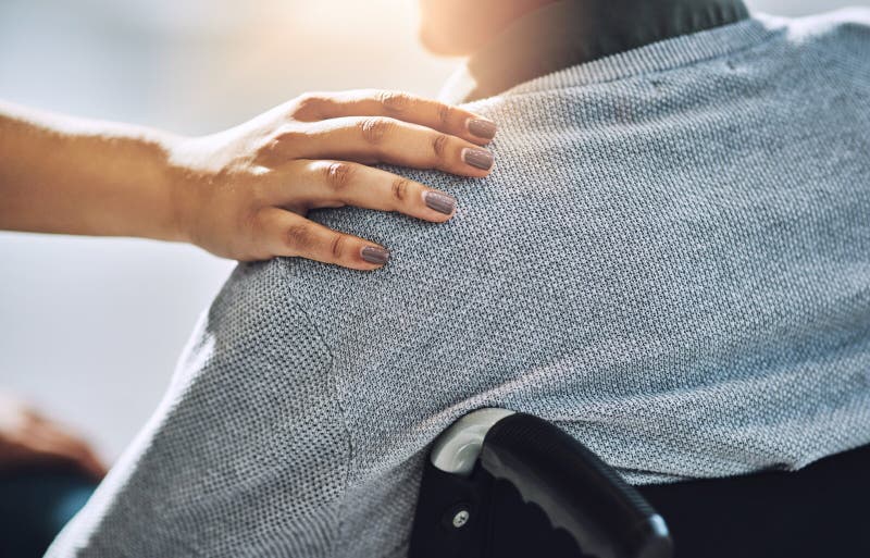 Someone Cares. a Friendly Medical Practitioner Assisting a Handicapped ...