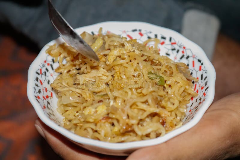 Someone Eating Noddles in a White Plate with Spoon Stock Photo - Image ...