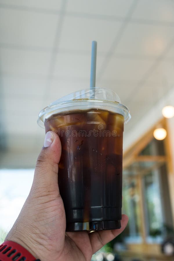 Someone Hand Holding a Plastic Cup of Iced Americano Stock Image ...