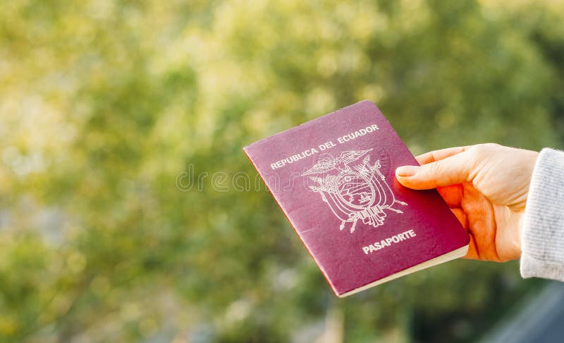 Someone Holding a Passport from the Republic of Ecuador, . Stock Image ...