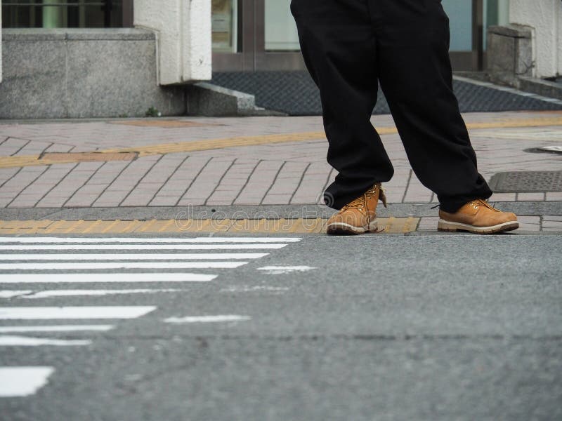 Someone Wait Across the Road Stock Image - Image of sign, road: 74074505