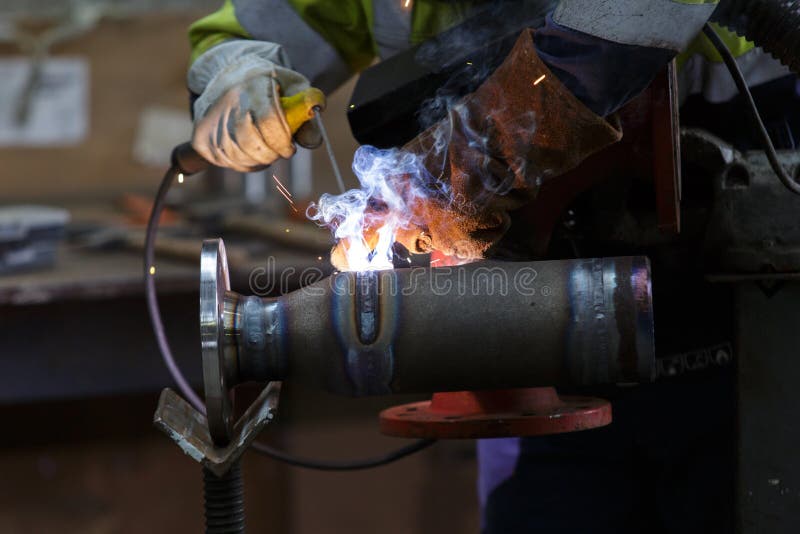 Someone welding in factory stock image. Image of hands - 173515739