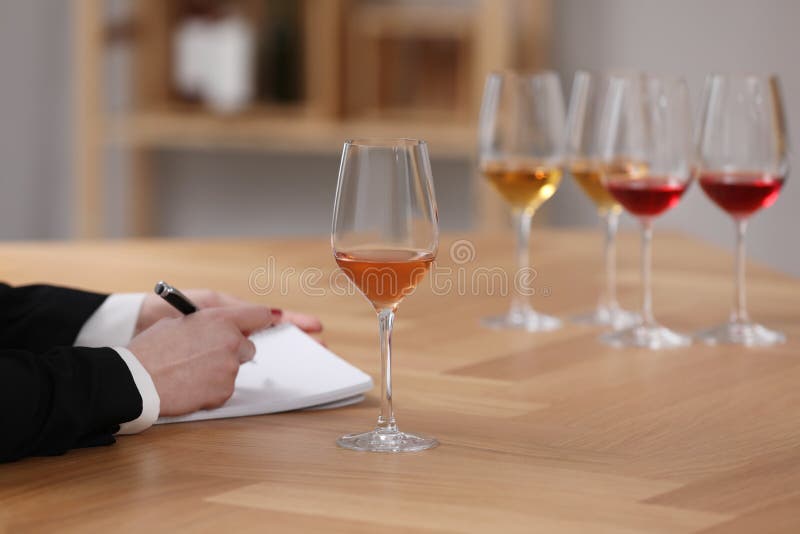 Sommelier Making Notes during Wine Tasting at Table Indoors, Closeup ...